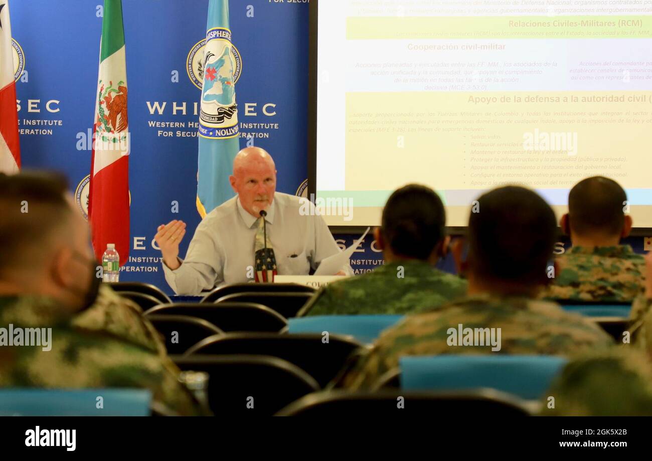 COL (R) Christopher Holshek addresses IACAP students as he delivers his ...