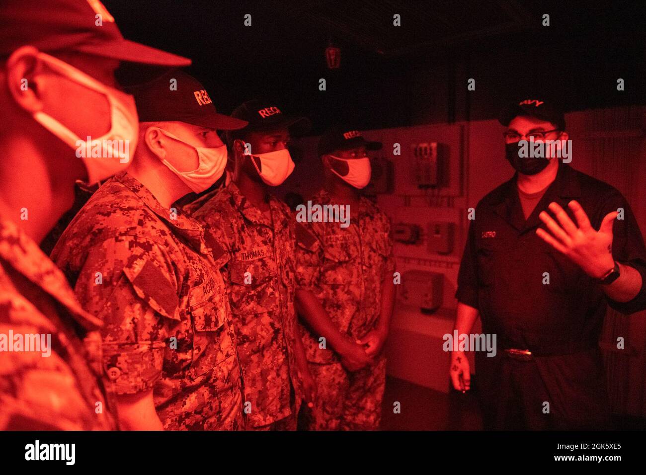 Recruits receive instructions for a training scenario inside of the ...