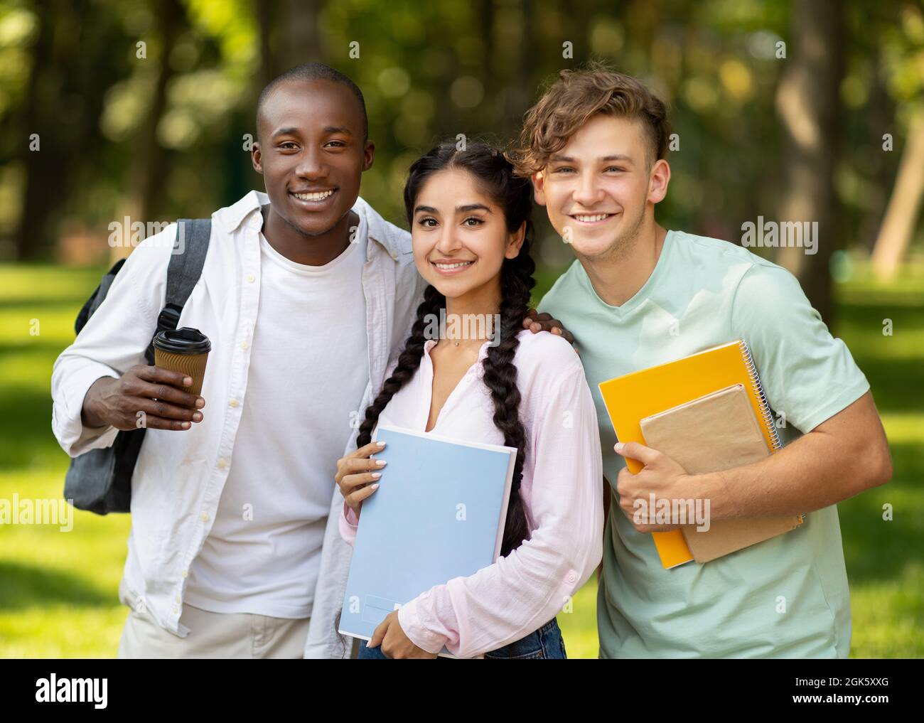 Happy international university students having break after classes and ...