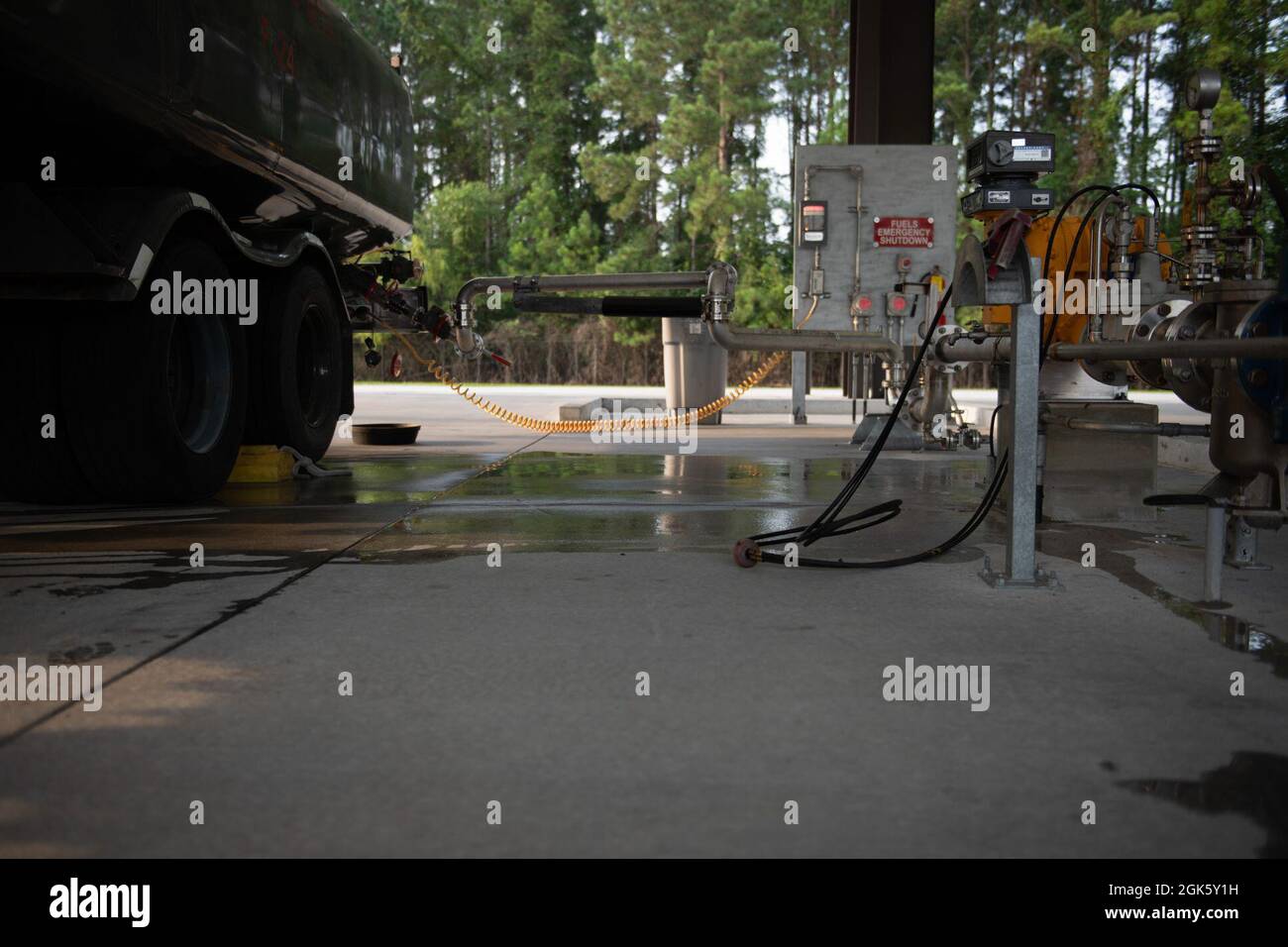 puddle of water simulates a fuel spill during an exercise at Moody Air ...