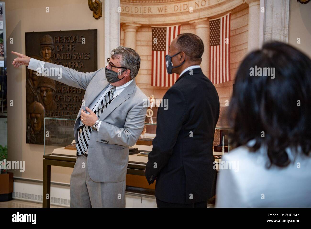 Rod Gainer (left), historian, Arlington National Cemetery, gives a tour ...