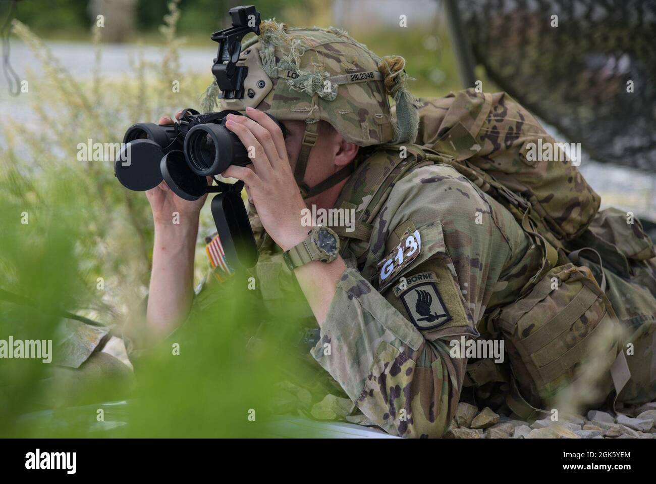 U.S. Army Spc. Austin Long, assigned to 173rd Airborne Brigade, scans ...