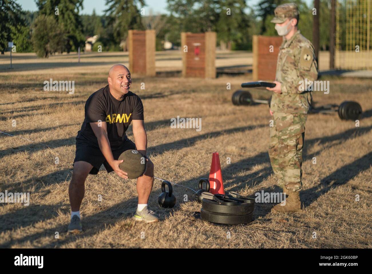 A Soldier with the 7th Infantry Division swings a 10-pound medicine ...