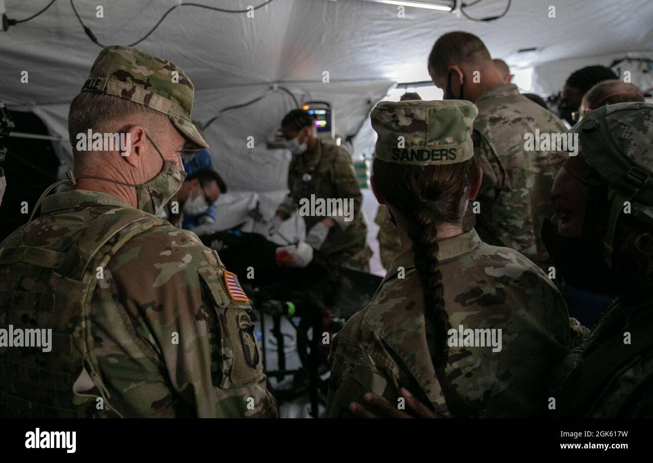 Gen. James C. McConville, Chief of Staff of the Army, listens to Col ...
