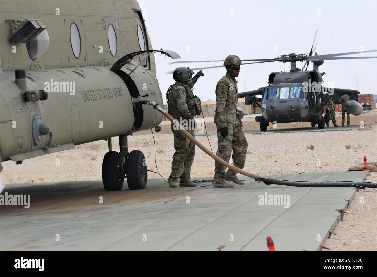 Task Force Phoenix Soldiers refuel a CH-47 Chinook helicopter from B ...