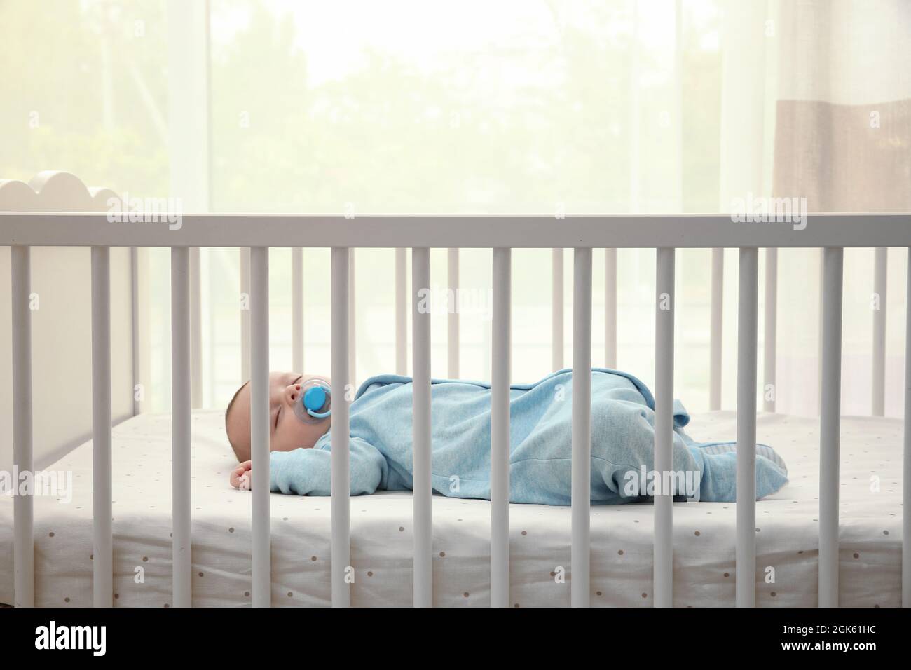 Cute little baby sleeping in cradle at home Stock Photo - Alamy