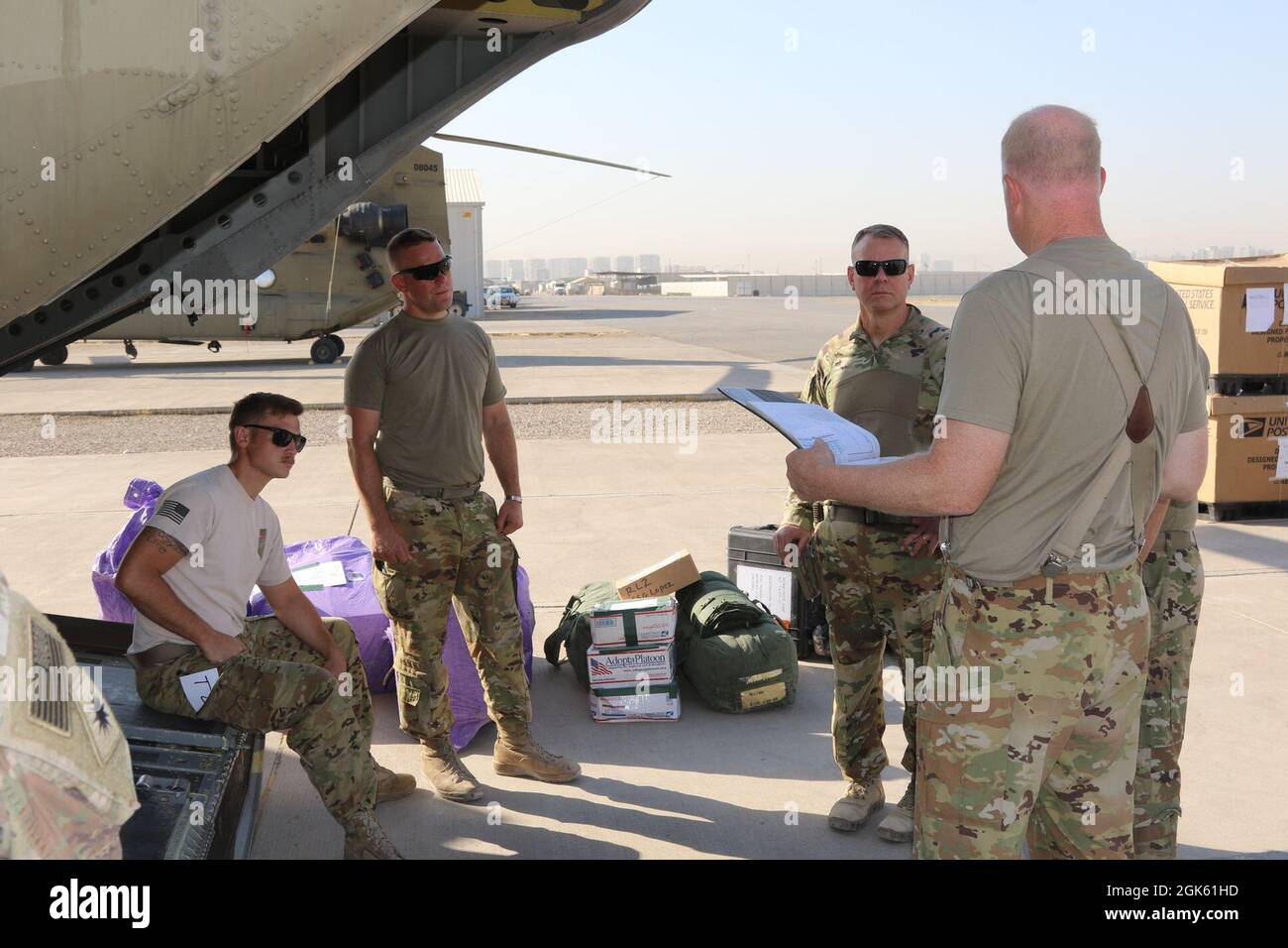 Pilot-in-command Chief Warrant Officer 3 Chris Slavin, right, briefs a ...