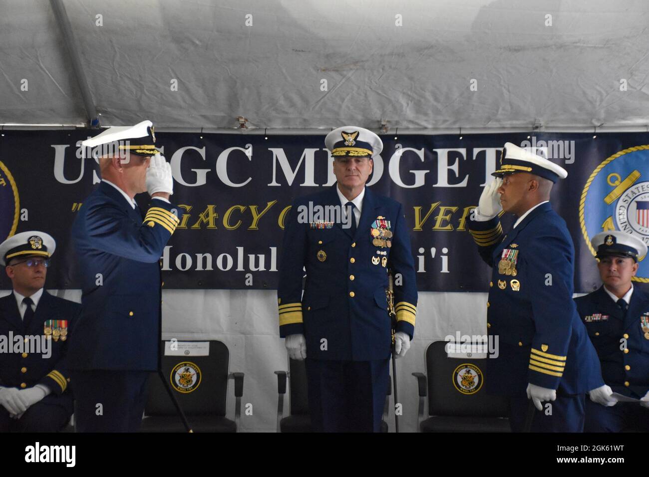 Vice Adm. Michael Mcallister (center), Pacific Area commander, observes ...