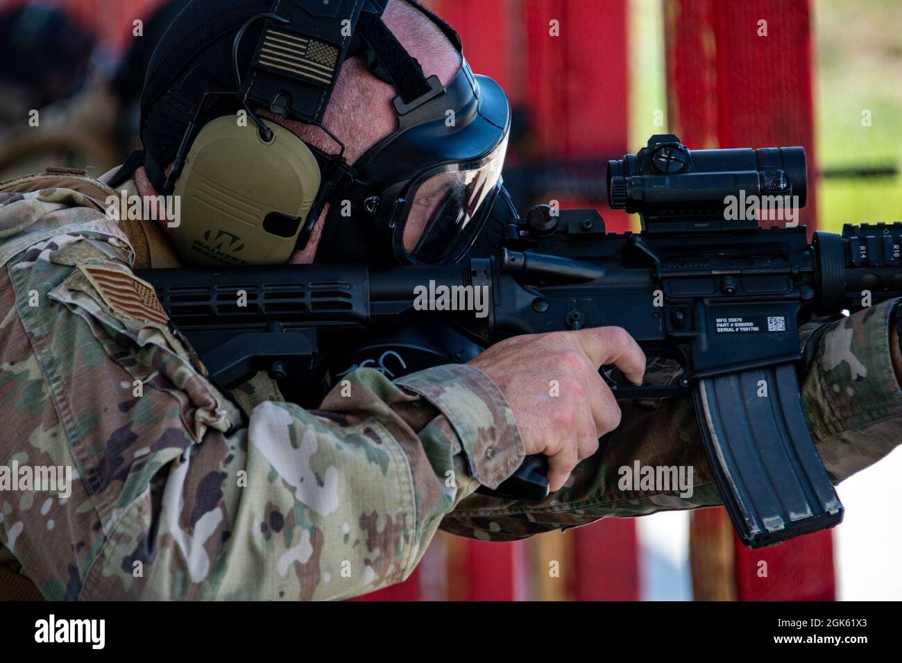 An Airman assigned to the 355th Security Forces Squadron fires an M4 ...