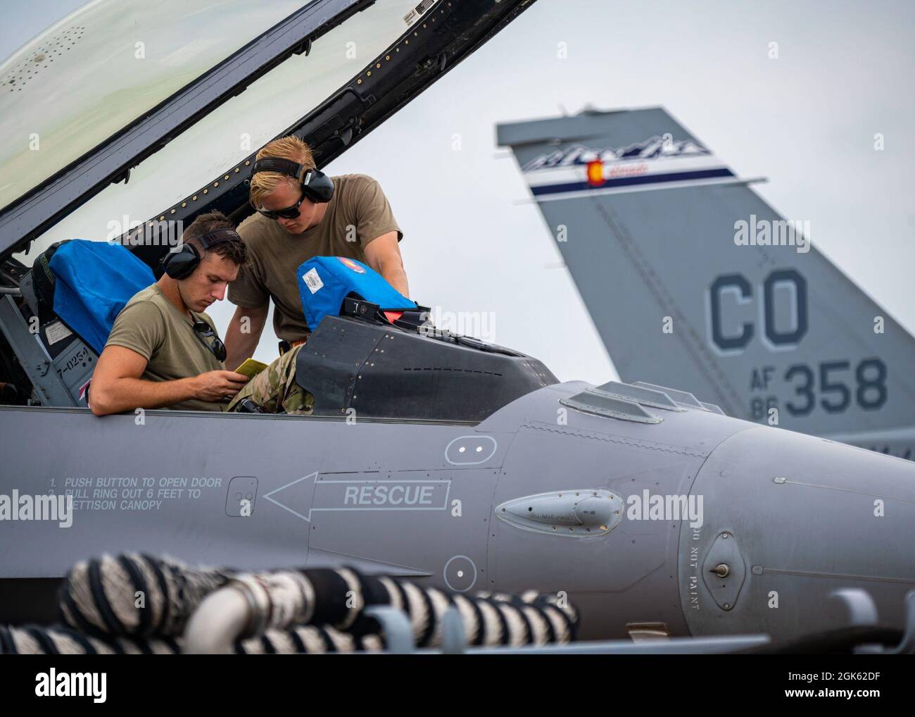 U.S Air Force Senior Airman Daniel Seese and Staff Sgt. Drew Achtermann ...