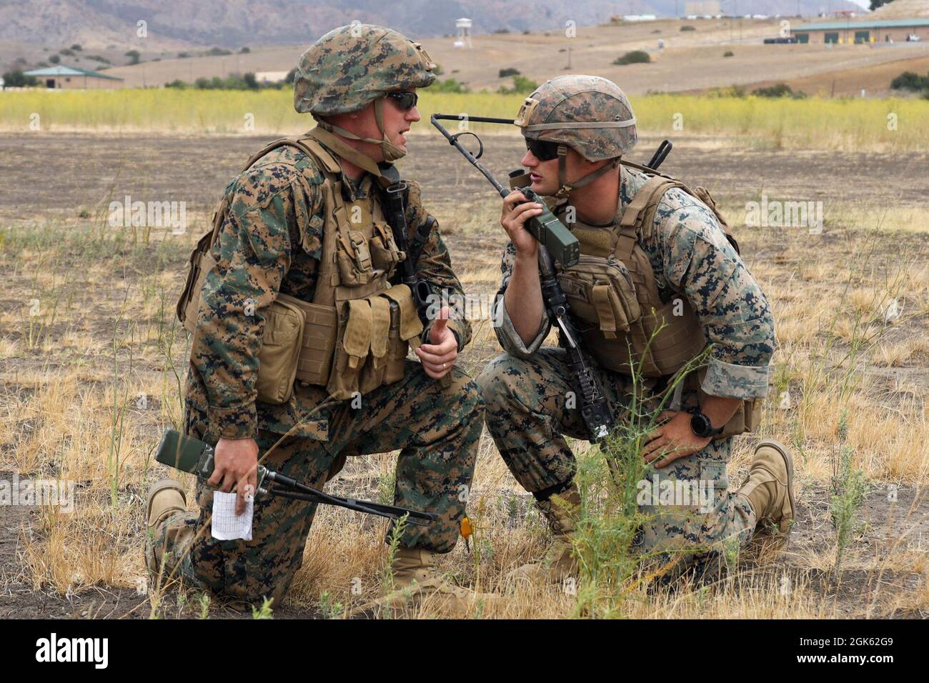 U.S. Marine Corps Gunnery Sgt. Edward Keech (left) and Cpl. Noah ...