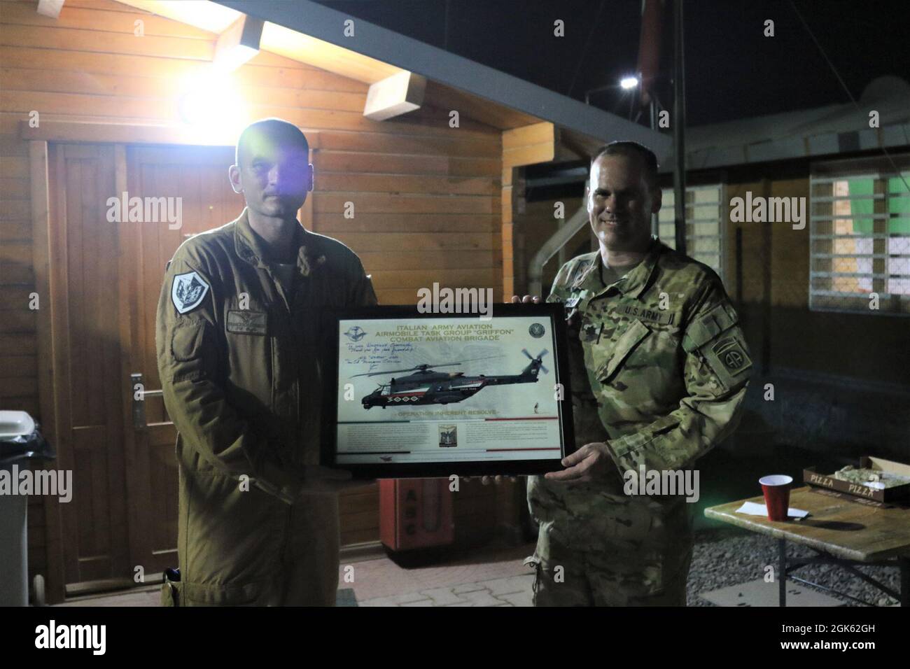 Task Force Wolfpack commander Lt. Col. James Snowden is presented a ...