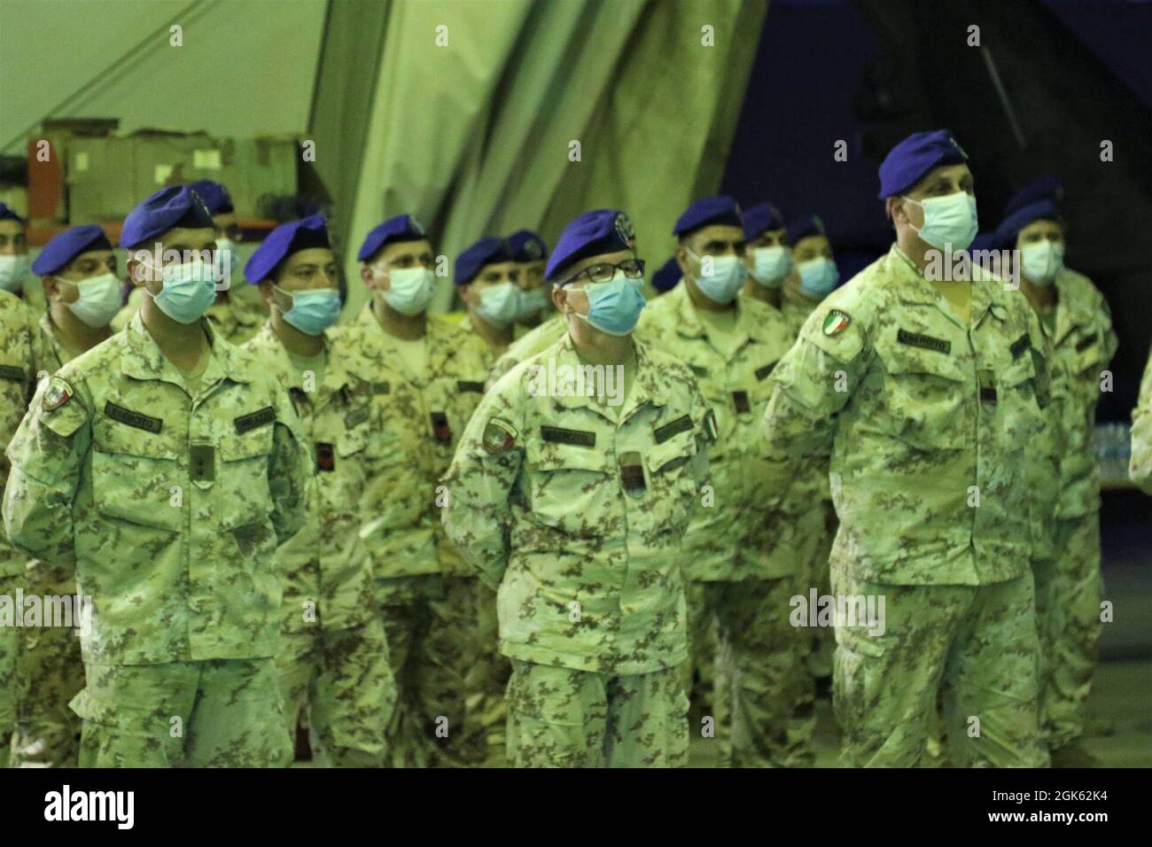 Soldiers from the Italian Army's Task Force Griffon stand in formation ...