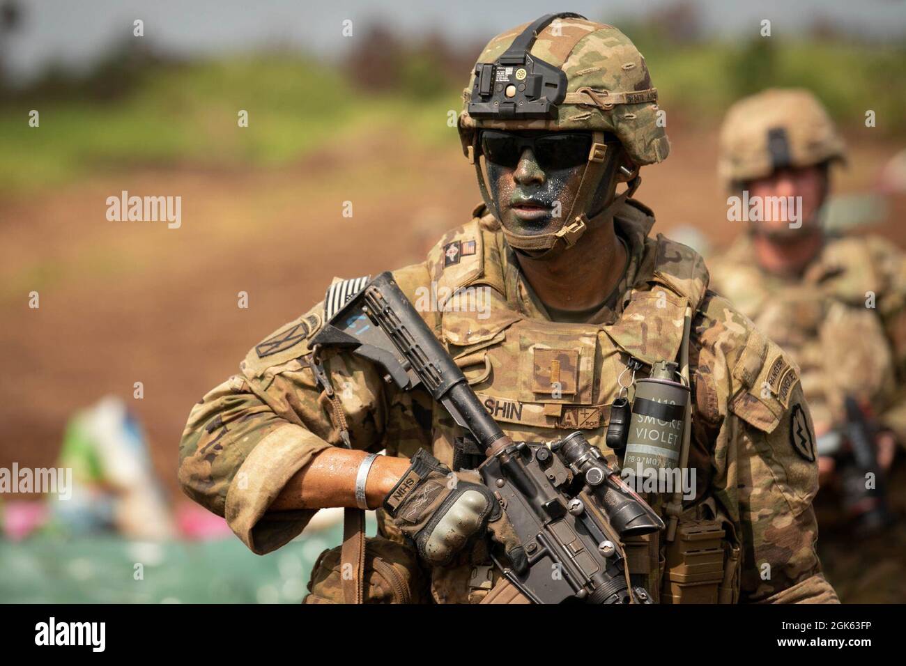 A U.S. Army platoon leader with Task Force Warrior checks on his ...