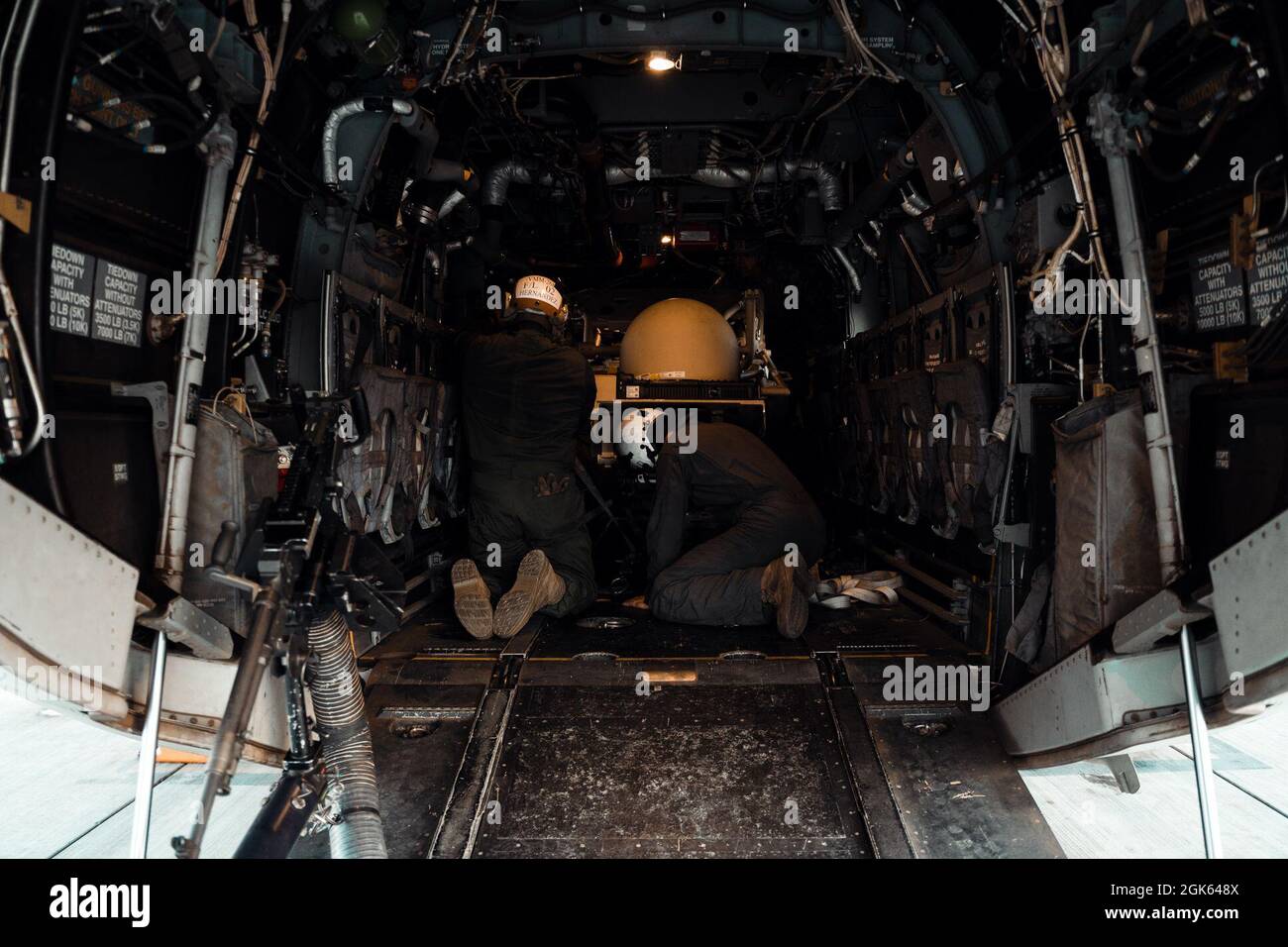 U.S. Marines with Marine Aviation Weapons and Tactics Squadron One load ...