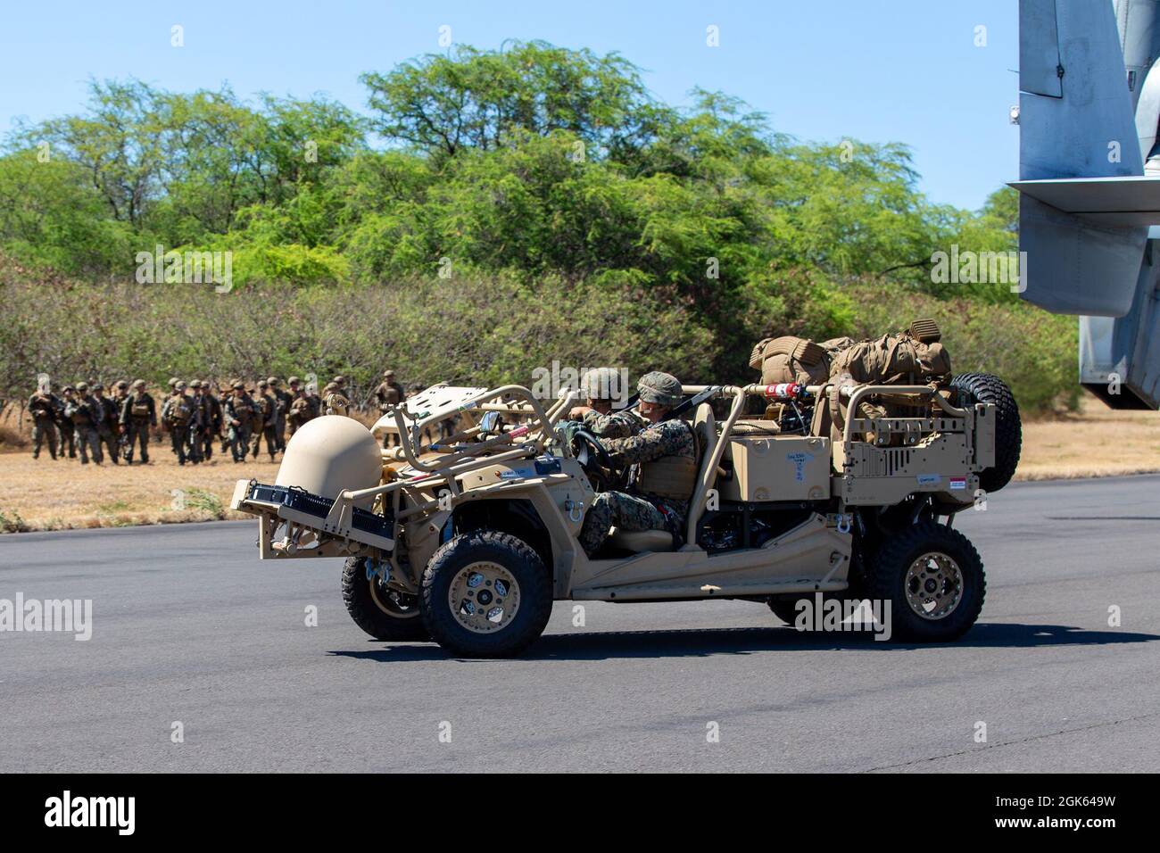 U.S. Marines with 3d Marines, 3d Marine Division, offload a Network On ...