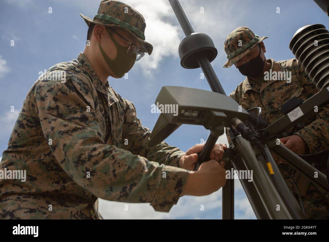 U.S. Marine Corps Cpl. Peter Chang (left), and Lance Cpl. Jean ...