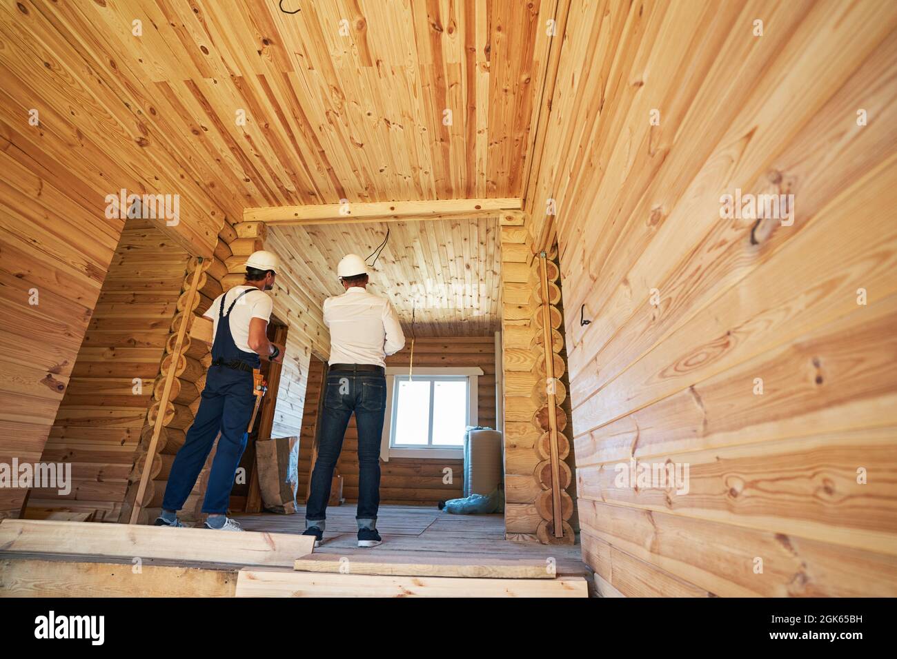 Civil engineer and builder watching at room in development Stock Photo ...