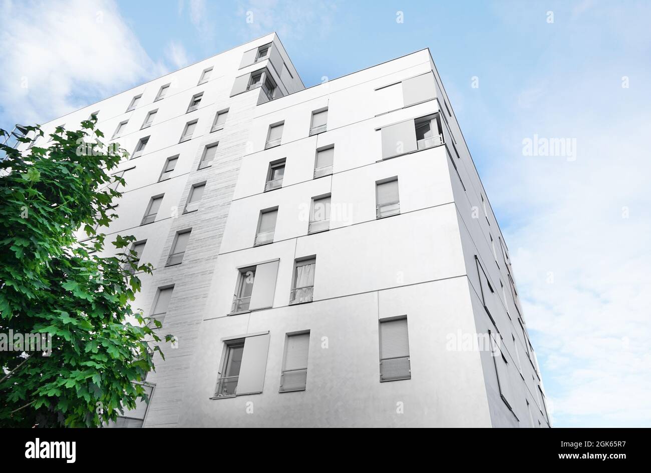 Modern building with windows on sky background Stock Photo - Alamy