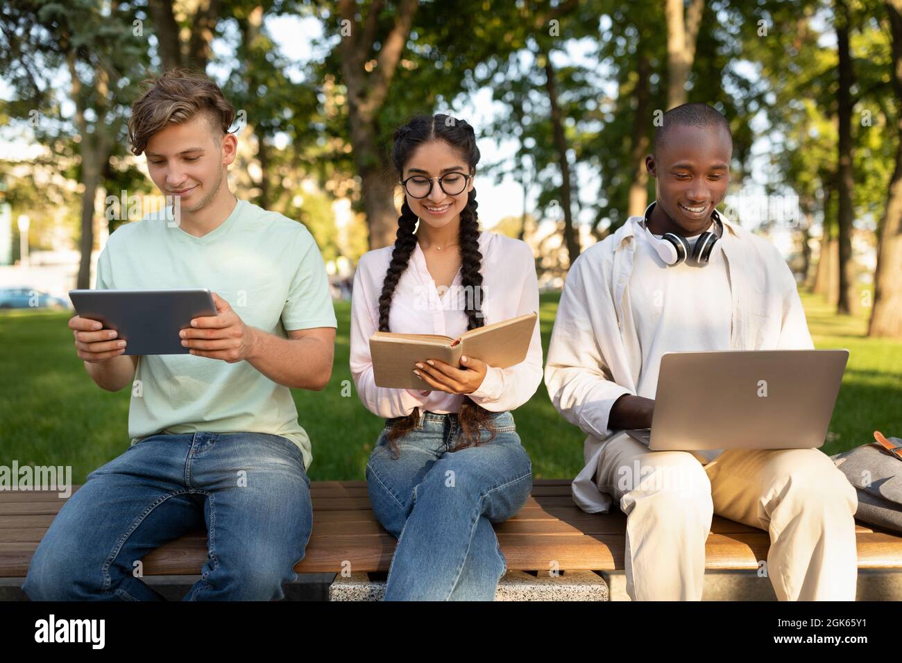 International college classmates preparing for lectures outdoors ...