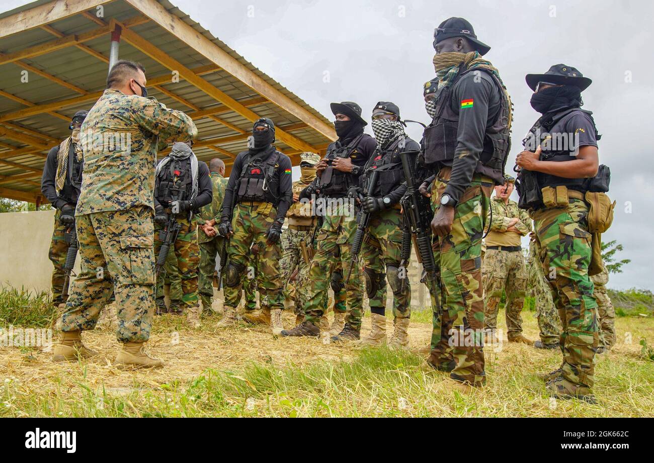 A U.S. Marine with Combined Task Force-68 teaches a class at the Naval ...