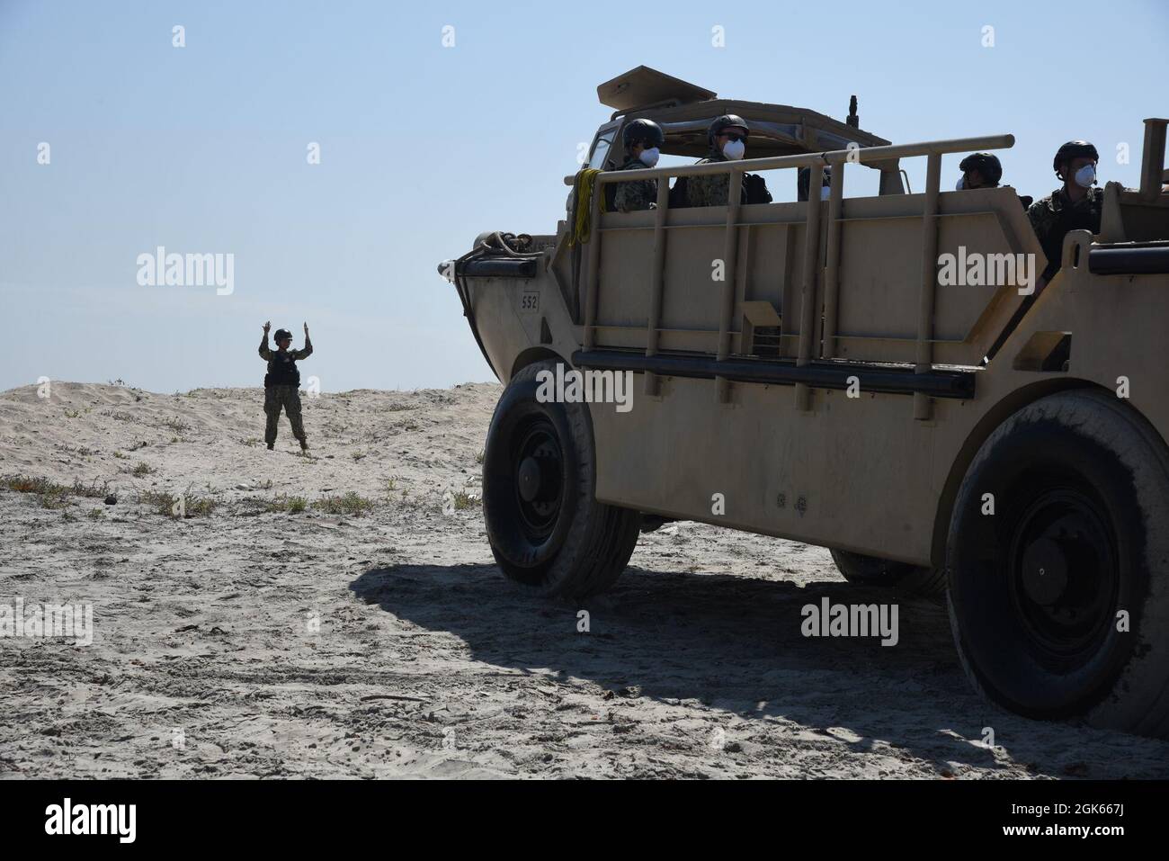 A Sailor assigned to Beachmaster Unit 1 directs a Lighter Amphibious ...