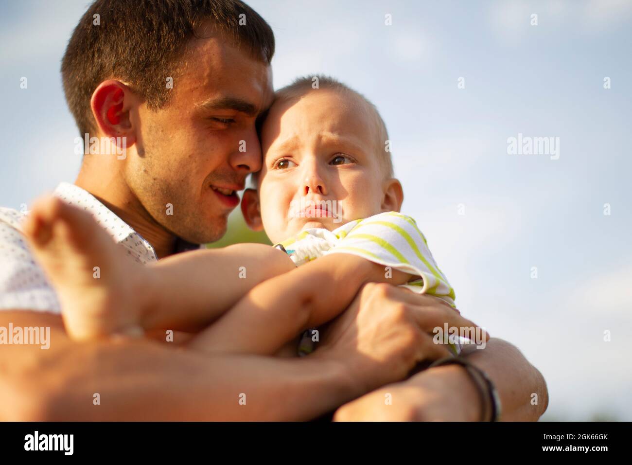Happy dad comforts his little crying son.Paternity Stock Photo - Alamy