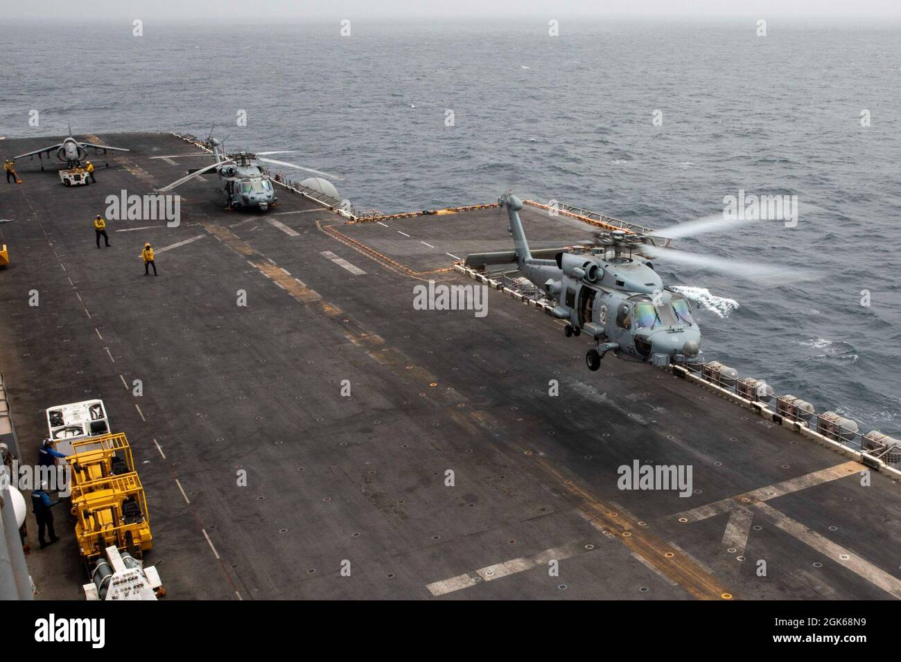 210813-N-OJ308-1028 GULF OF OMAN (Aug. 13, 2021) ) An MH-60R Sea Hawk ...
