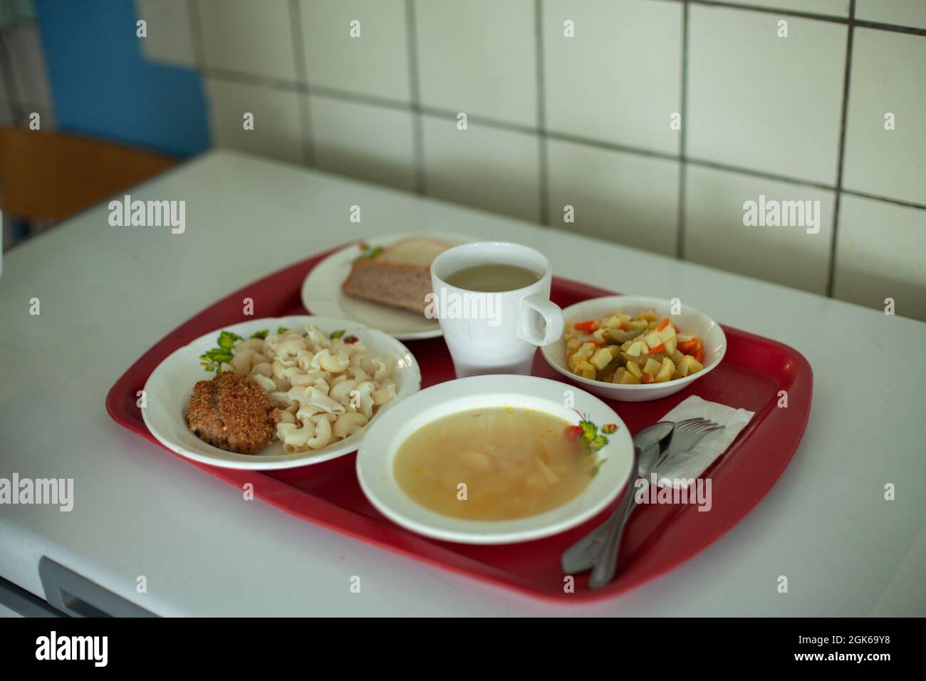 Food in the dining room. Lunch on a tray. Regular school meals. Meals ...