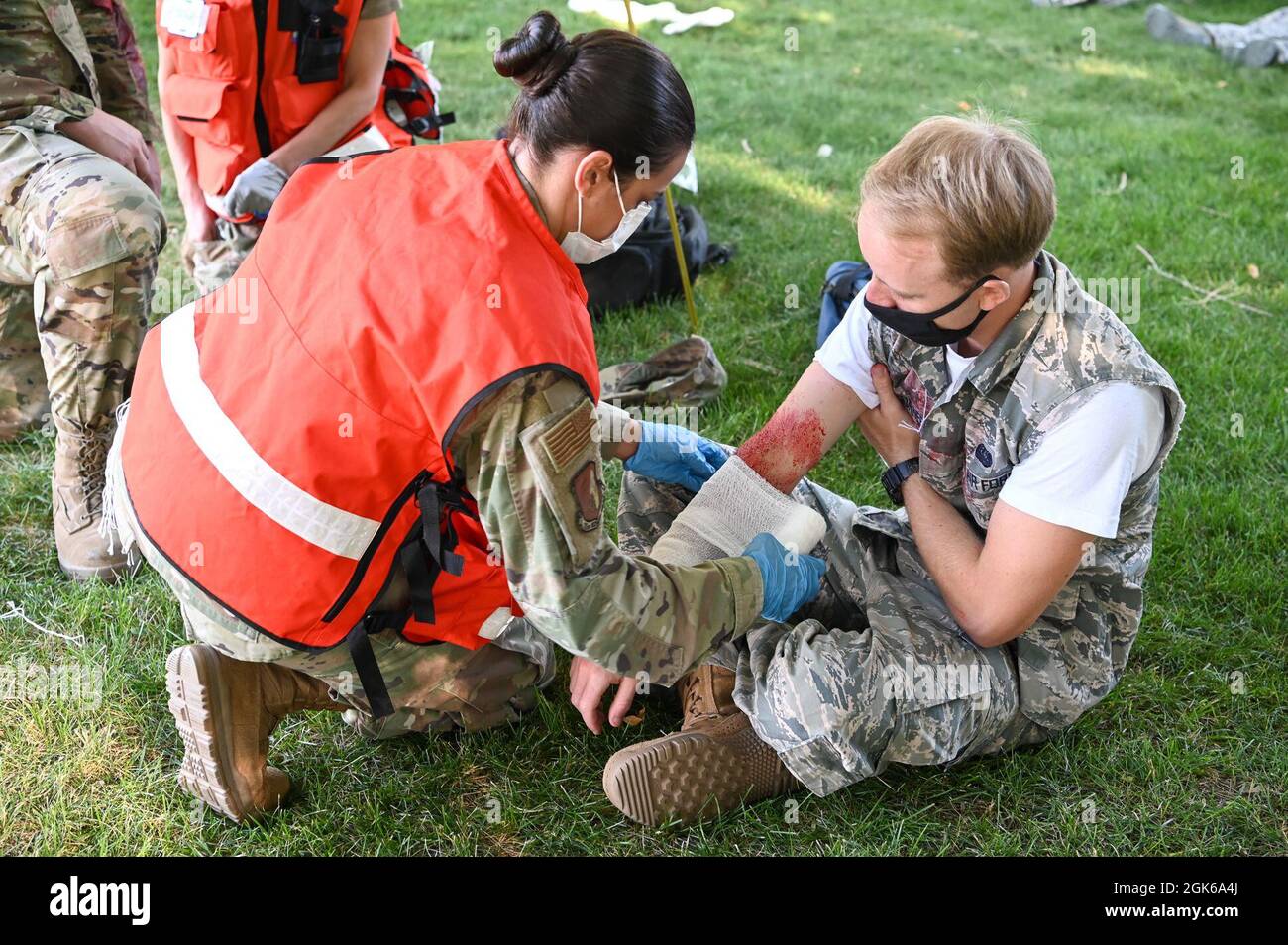 A member from 75th Medical Group triaging a simulated victim during a ...