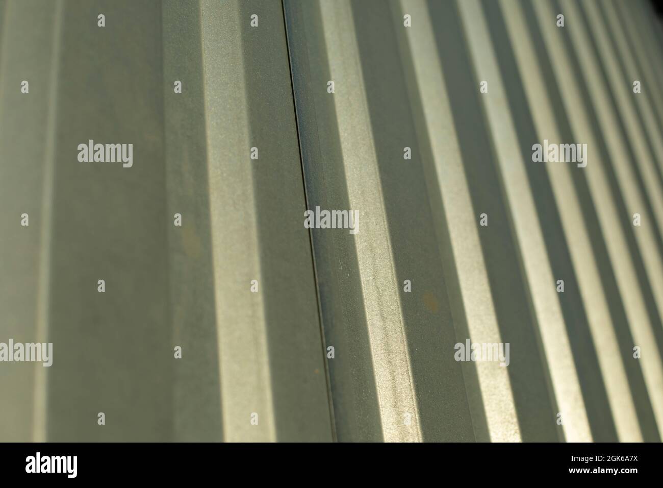 Metal fence in detail. Stainless steel of industrial production. Ribbed ...