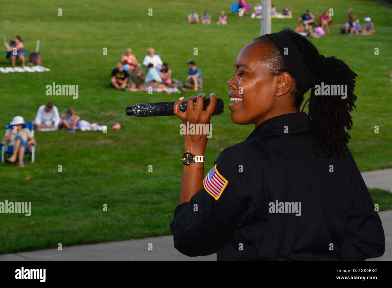 Senior Airman MeLan Smartt, Flight One vocalist, sings to the audience ...
