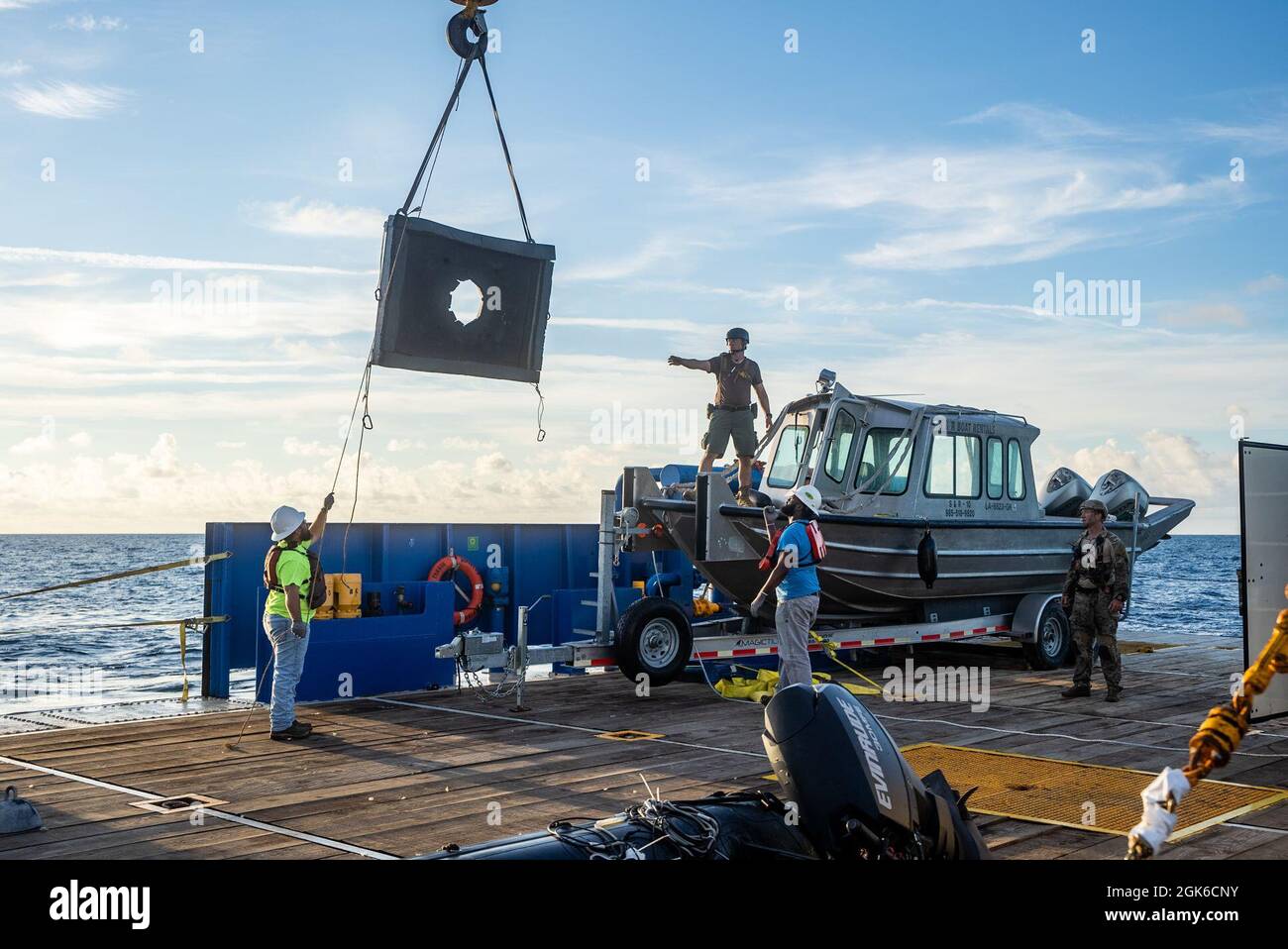 Navy Divers, assigned to Mobile Diving Salvage Unit (MDSU) 2, load a ...