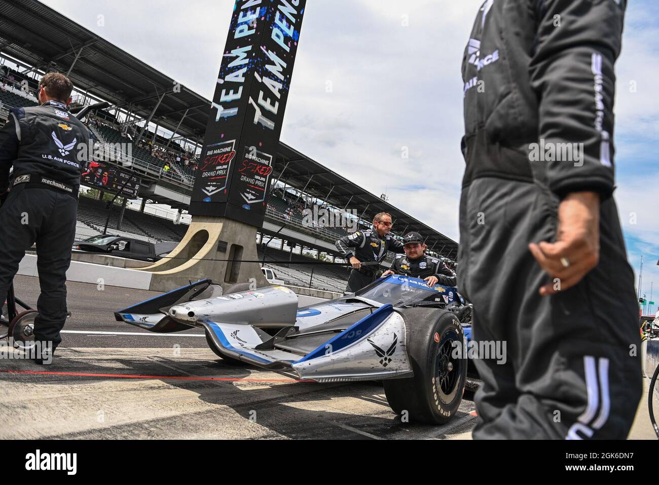 The pit crew for Conor Daly, Ed Carpenter Racing, tow his car back to ...