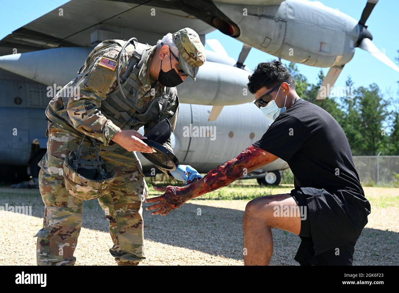 Fake blood is applied to actor U.S. Army Spc. Giovani Garcia, cable ...