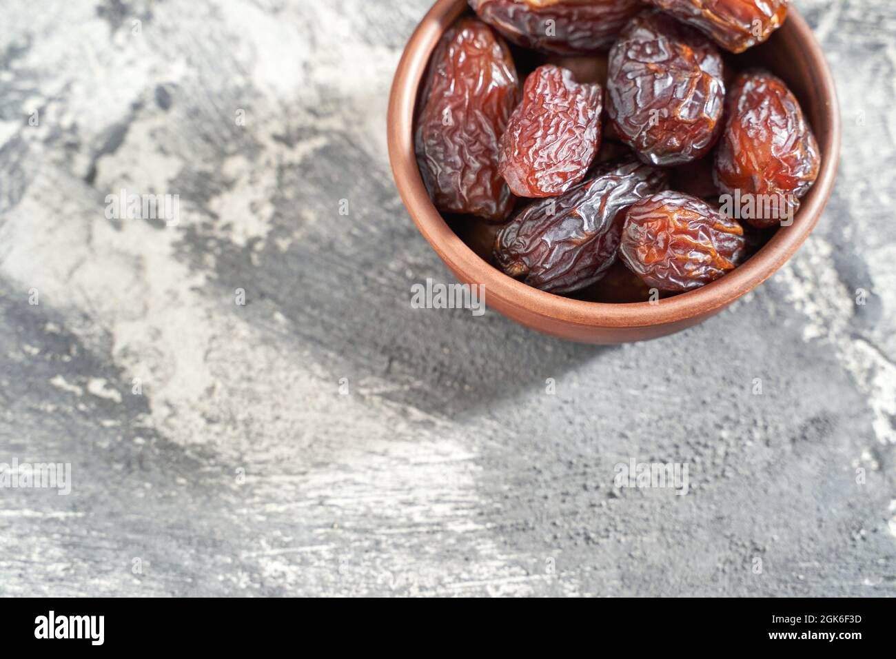 Bowl with dry dates. Top view. Healthy sweet snacks. Islamic turkish ...
