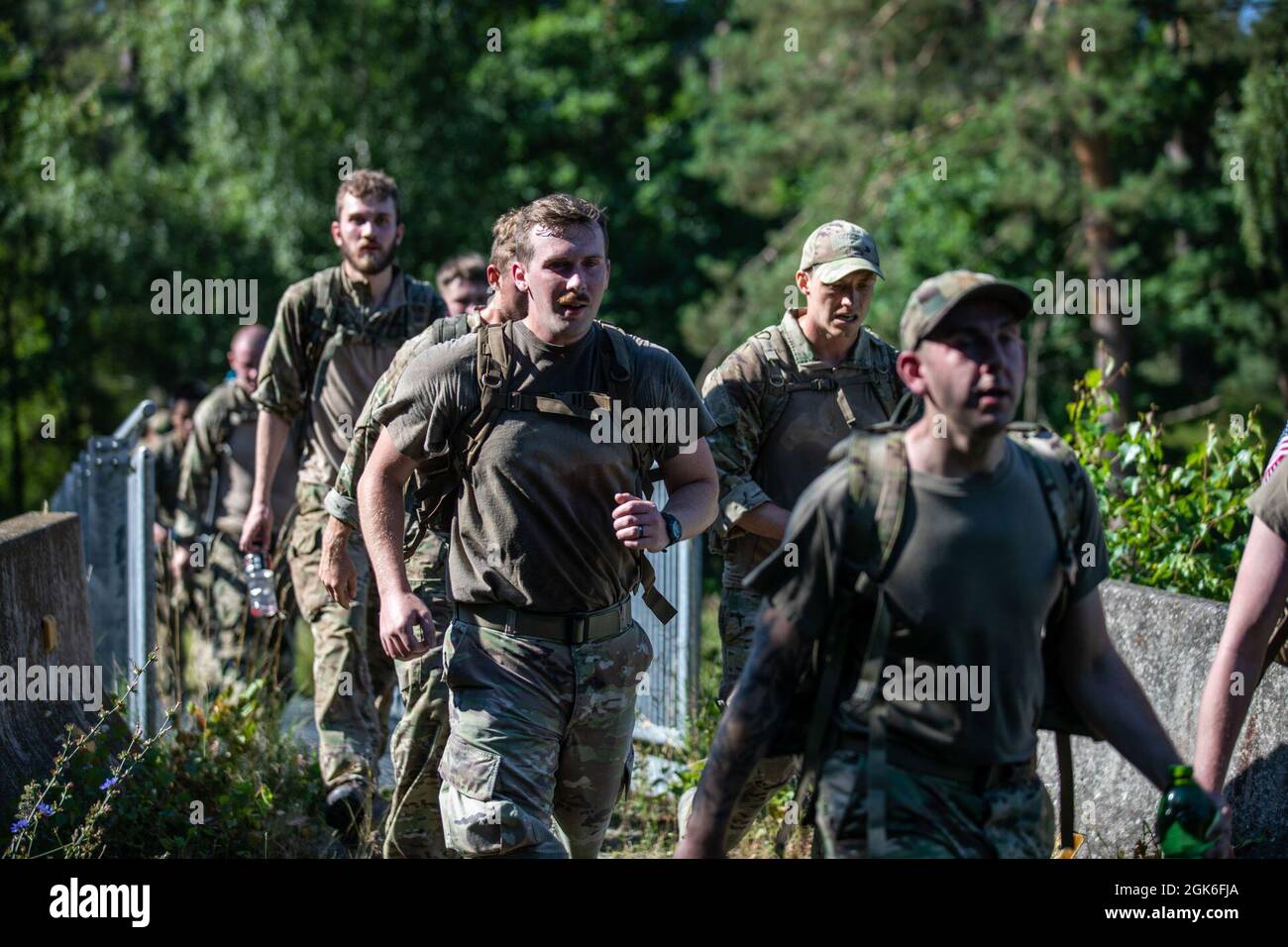 Competitors within the first Dancon March ruck along the trail Aug. 15 ...