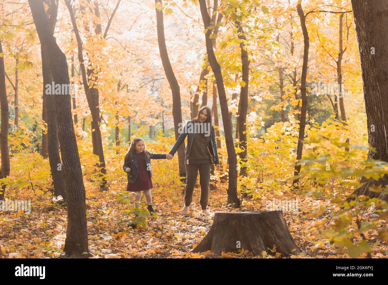 Mother and her little daughter in autumn park in fall season Stock ...