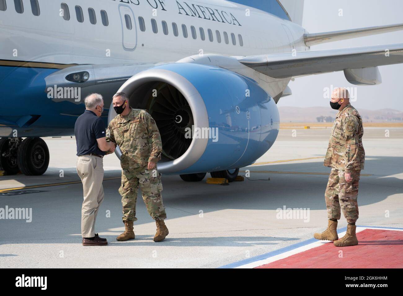 U.S. Air Force Col. Corey Simmons, center, 60th Air Mobility Commander ...
