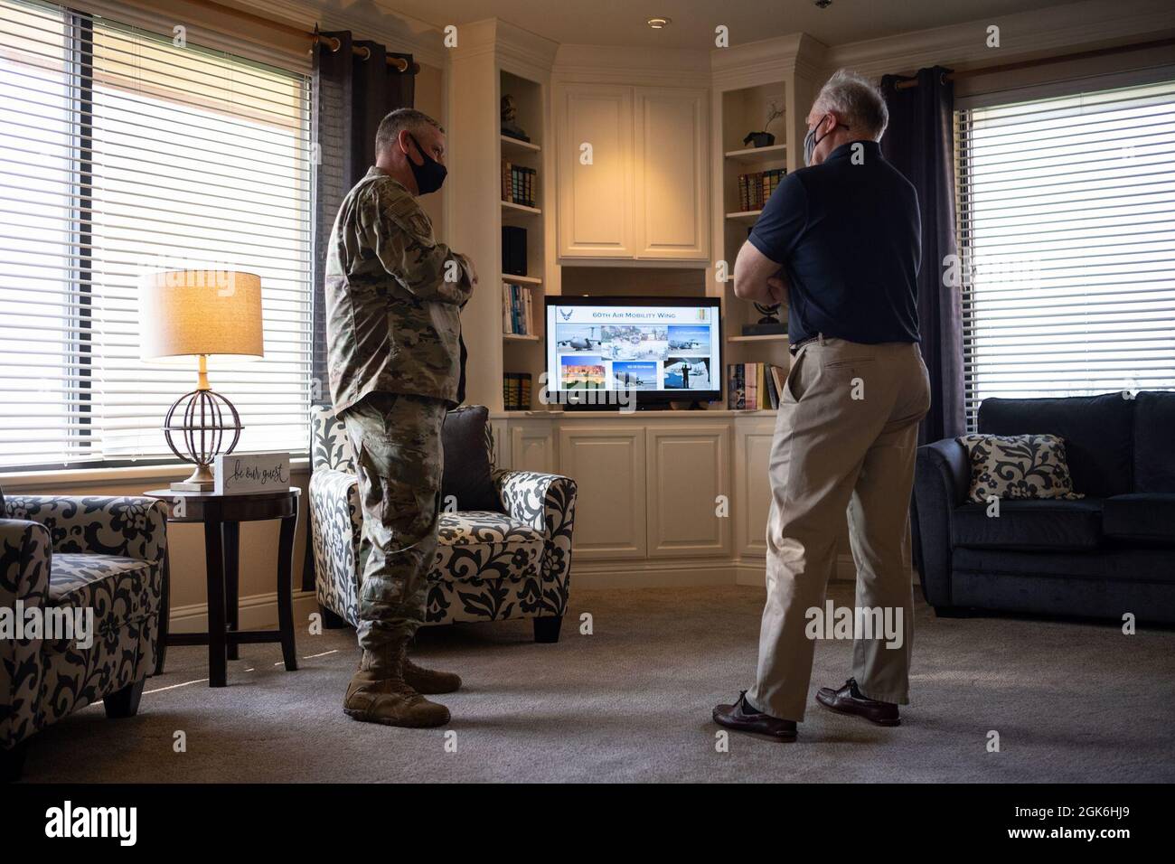 U.S. Air Force Col. Corey Simmons, left, 60th Air Mobility Commander ...