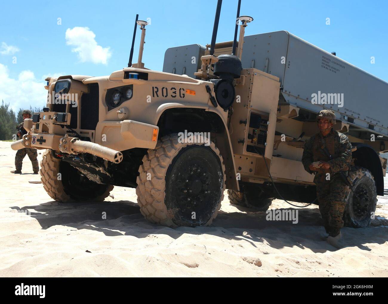 An artillery Marine from 1st Battalion, 12th Marines maneuvers a Navy ...
