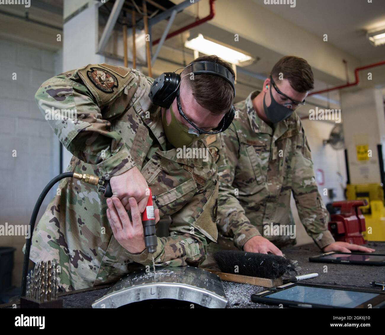 U.S. Air Force Airman 1st Class Matthew Traweek, left, 18th Equipment ...