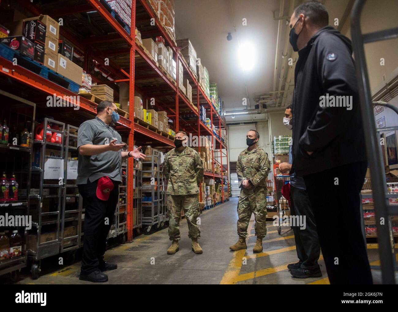 Mark Bissell, Misawa Commissary officer, talks to U.S. Air Force Col ...