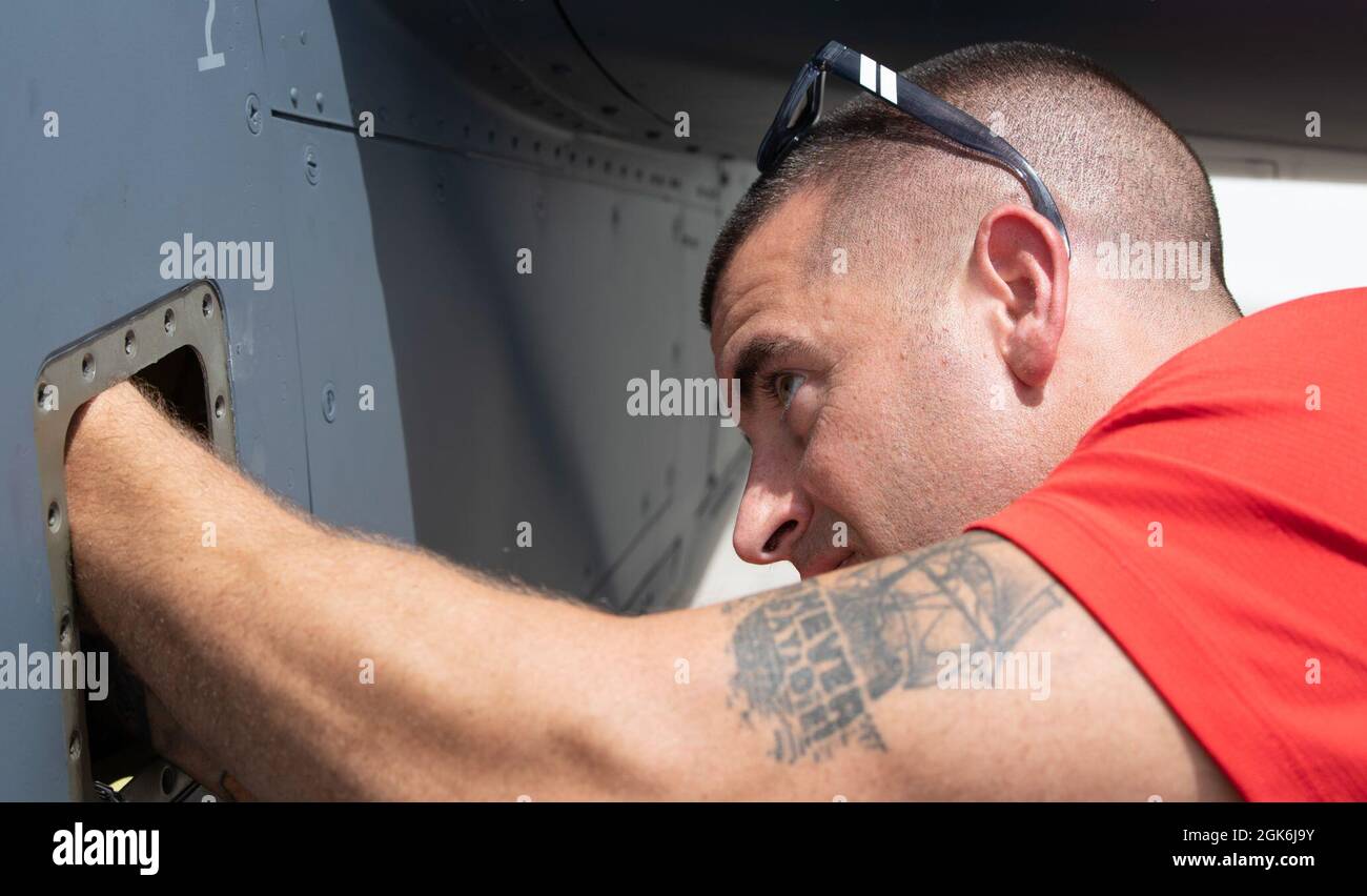 Kyle Beachem, a Lockheed Martin field service representative, secures a ...
