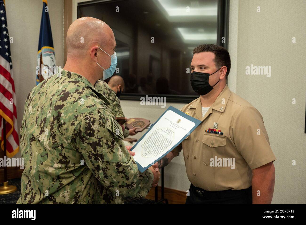 WASHINGTON, DC (Aug. 16, 2021) – Capt. Mark Burns (left), Naval Support ...