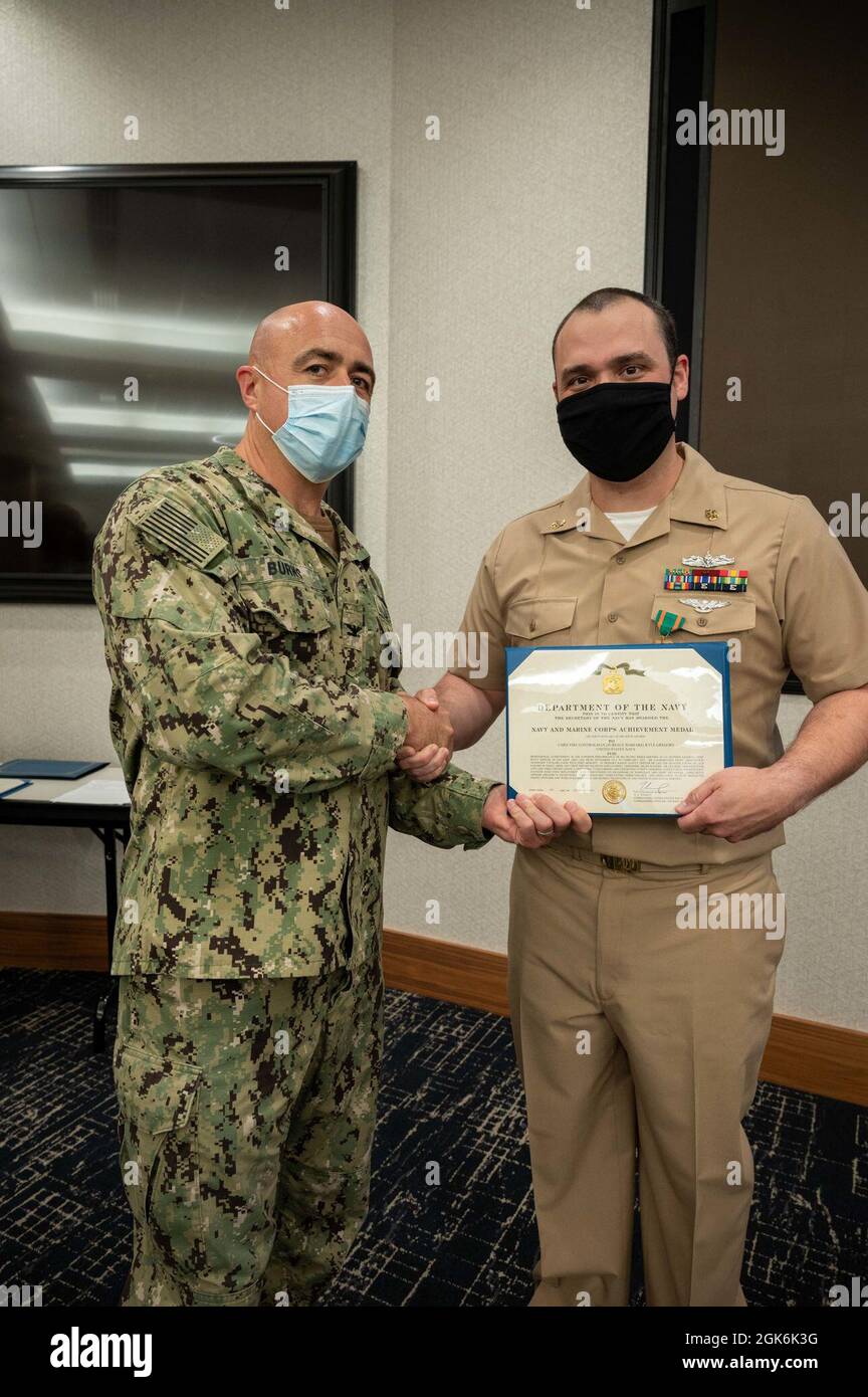 WASHINGTON, DC (Aug. 16, 2021) – Capt. Mark Burns (left), Naval Support ...