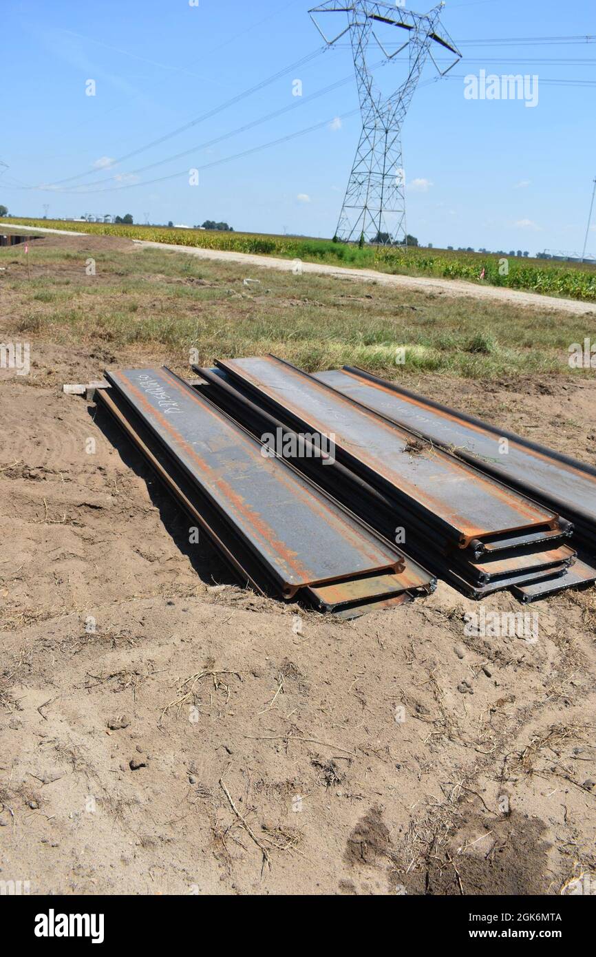 This prepositioned iron sheet piling near a worksite along the ...