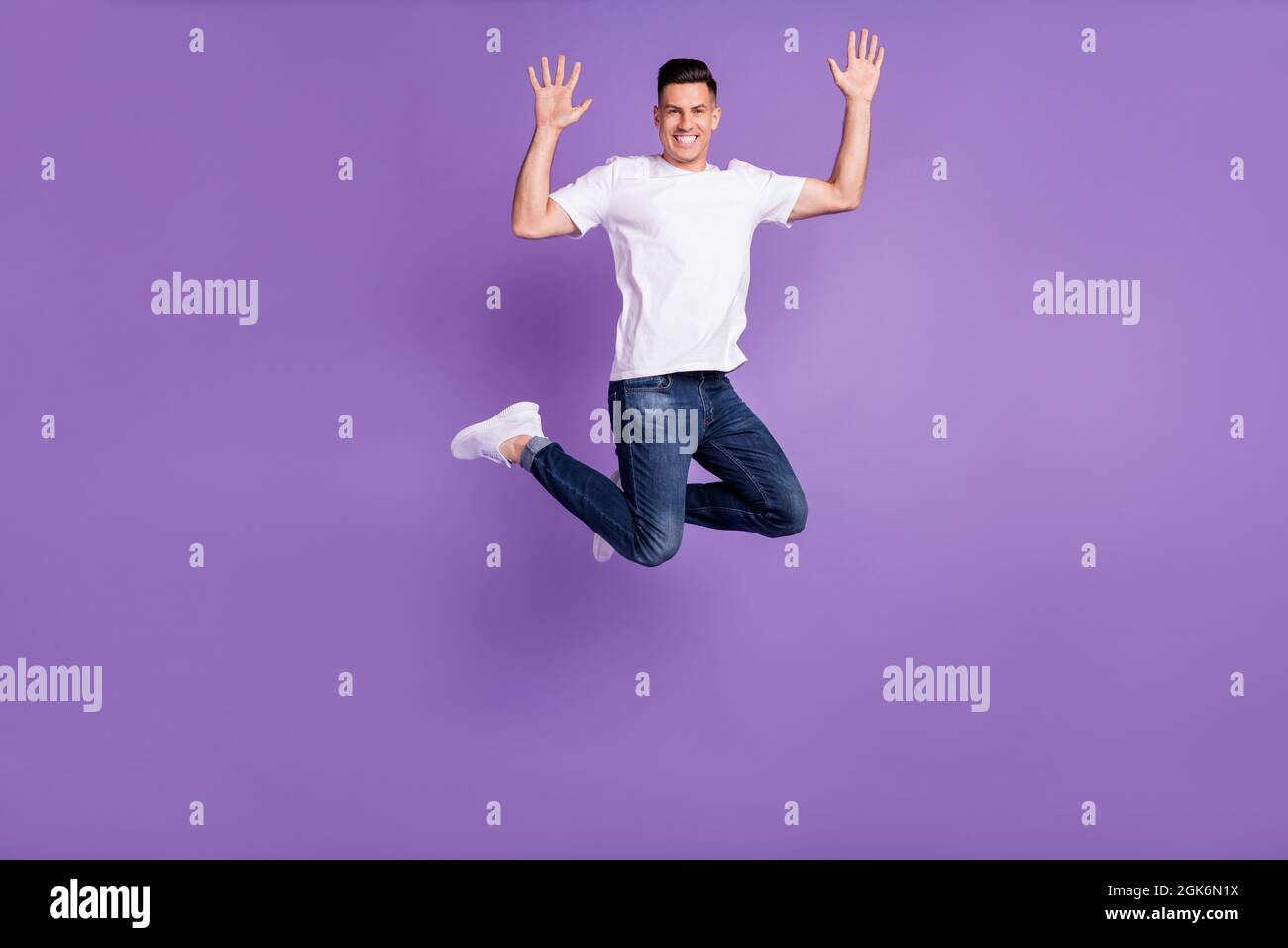 Full length photo of young man happy positive smile have fun jump ...