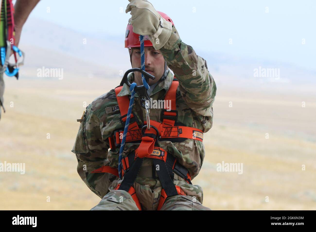 Spc. London prepares to descend the rappel tower during Warrior ...
