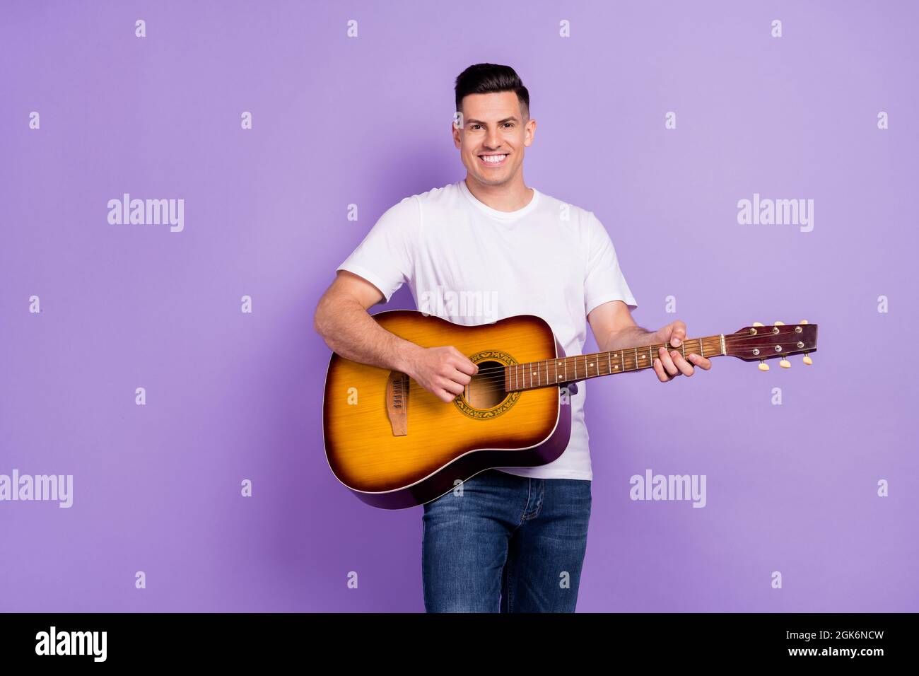 Photo of young man happy positive smile play guitar concert artist ...